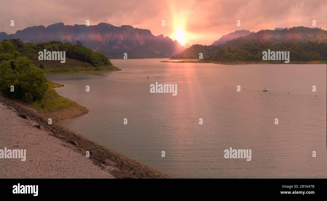 The Ratchaprapha dam in a Thailand national park at sunrise Stock Photo ...