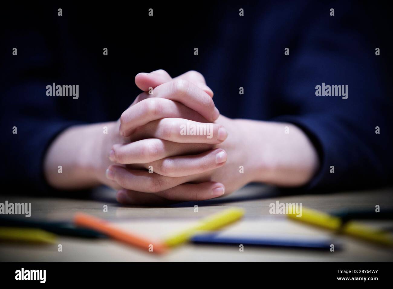A childs hands and crayons Stock Photo - Alamy