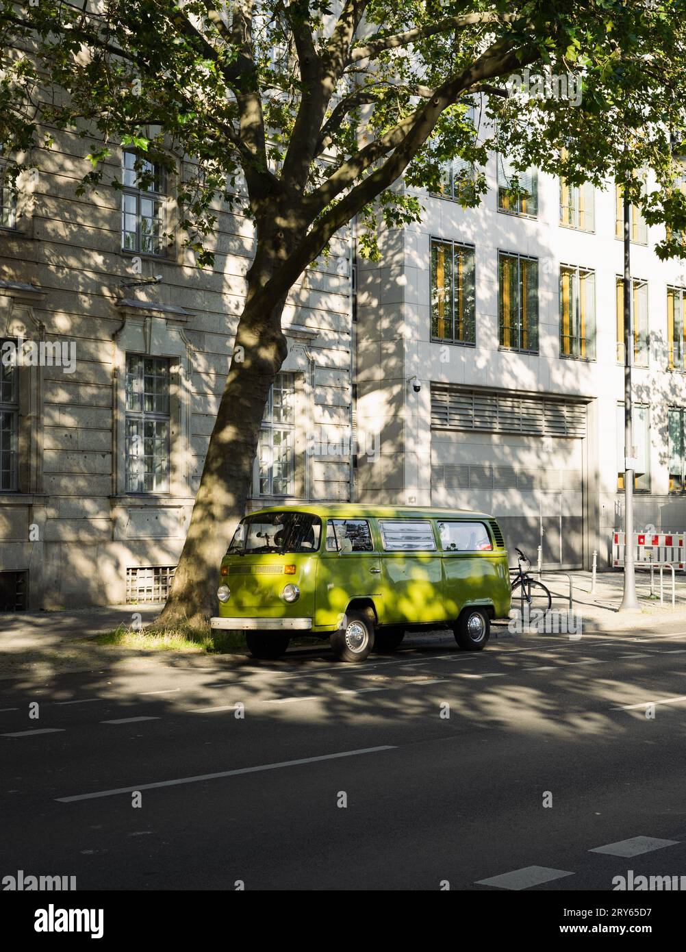 Retro minivan camper in green colour on city street of Berlin Stock ...