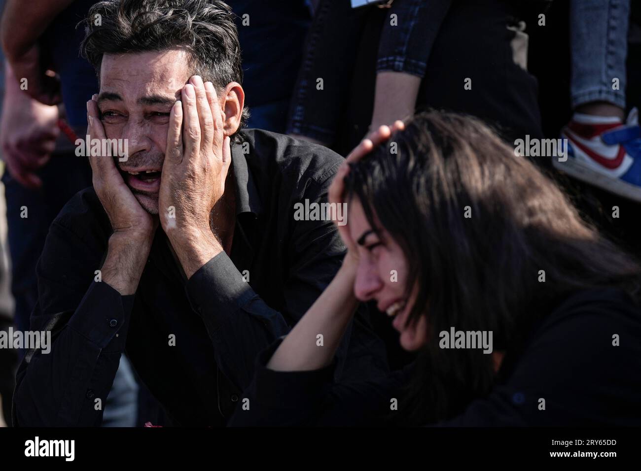Friends and relatives attend a funeral for the victims who died in a ...