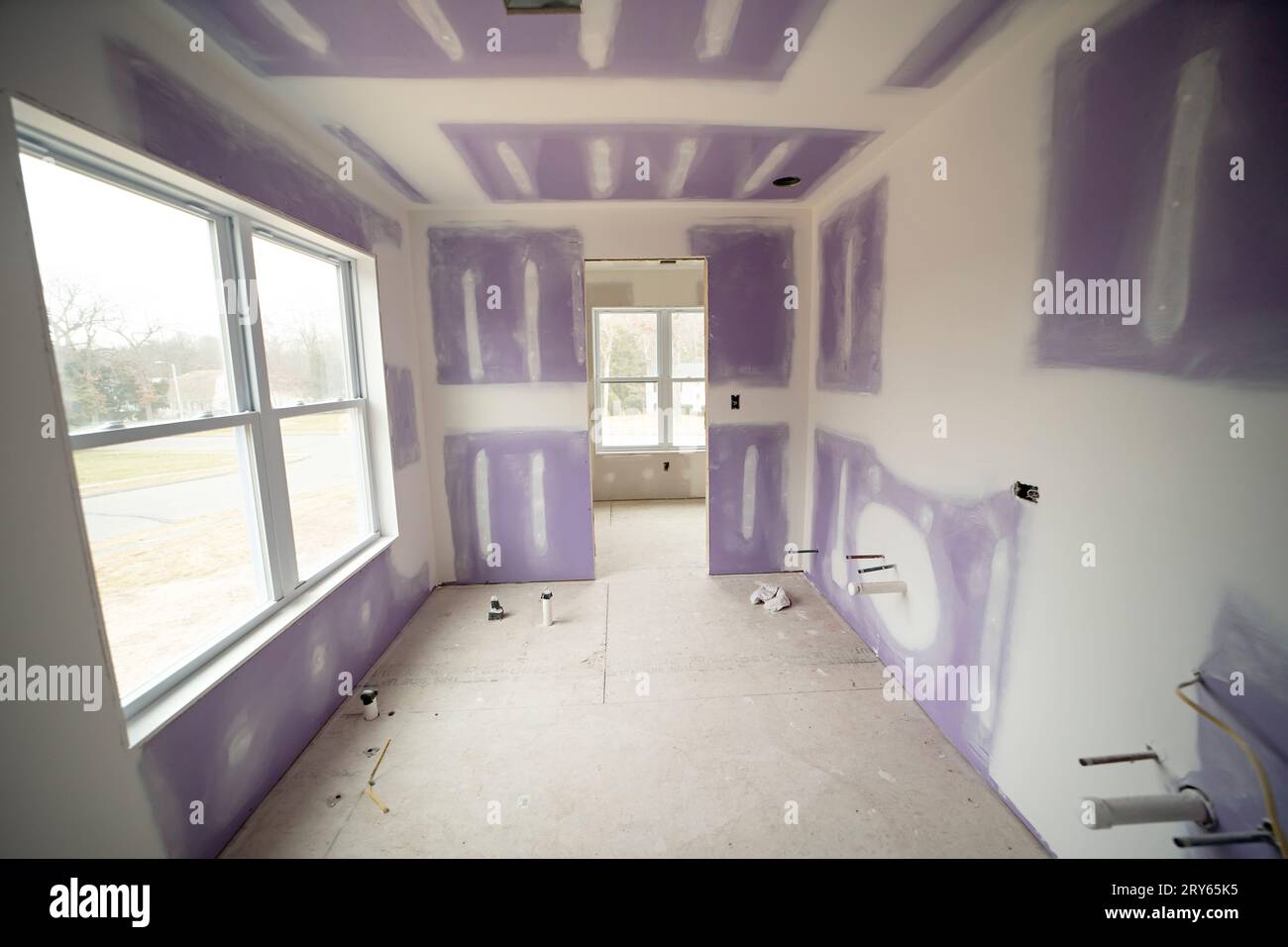 Small room under construction, featuring a prominent large window Stock ...
