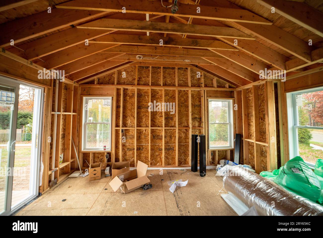Construction phase room, highlighted by a sliding glass door feature ...
