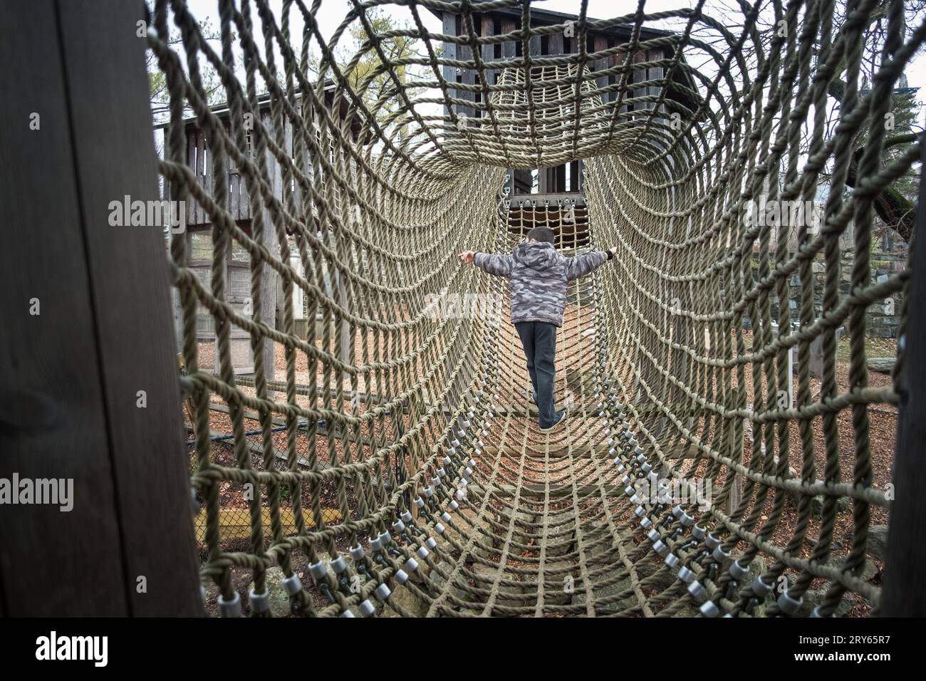 Child crossing rope bridge hi-res stock photography and images - Alamy