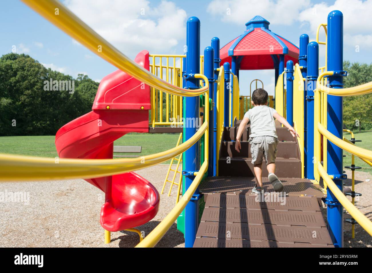 Boy running in adventure playground hi-res stock photography and images ...