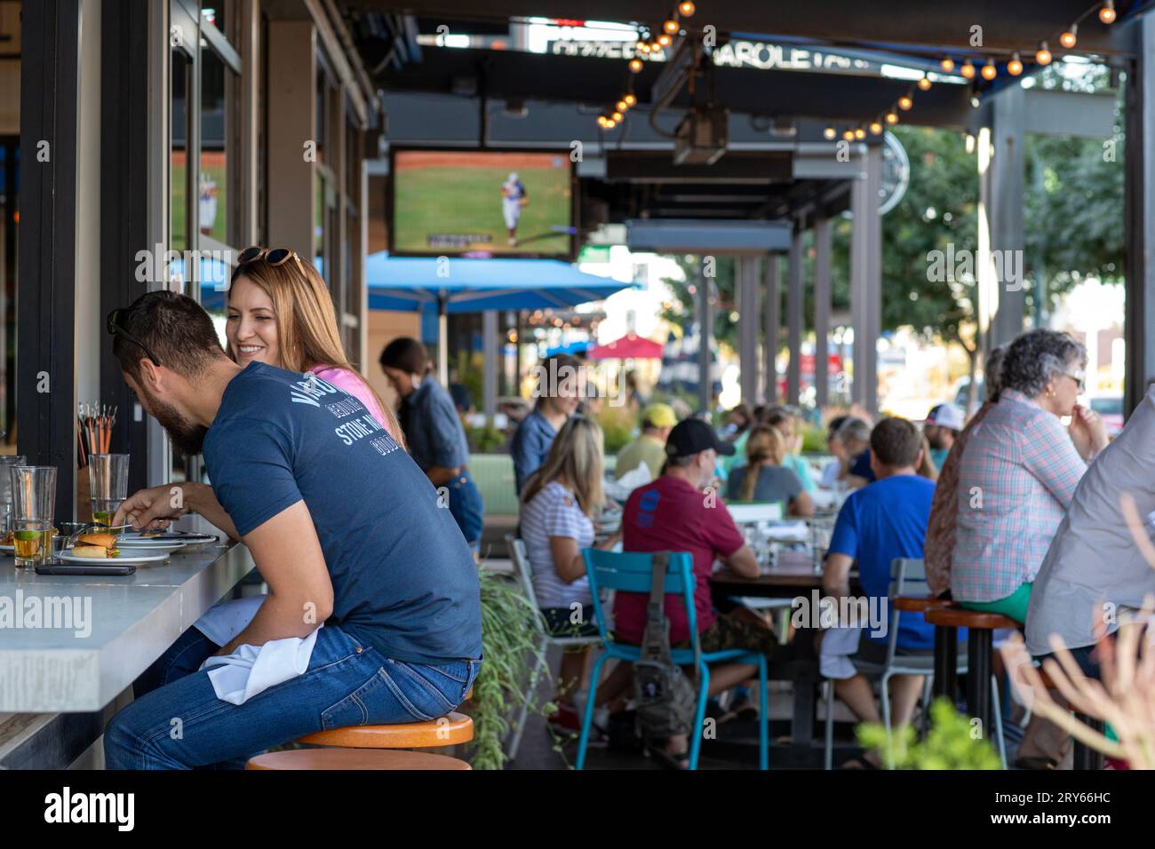 People dining outside on patio Stock Photo - Alamy