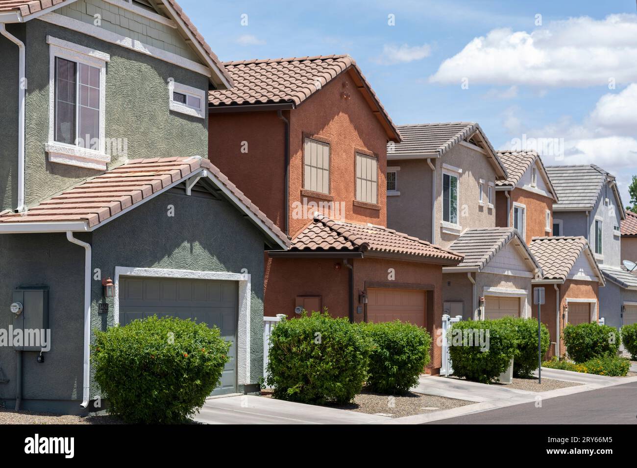 Row of similar houses painted different slightly colors Stock Photo - Alamy