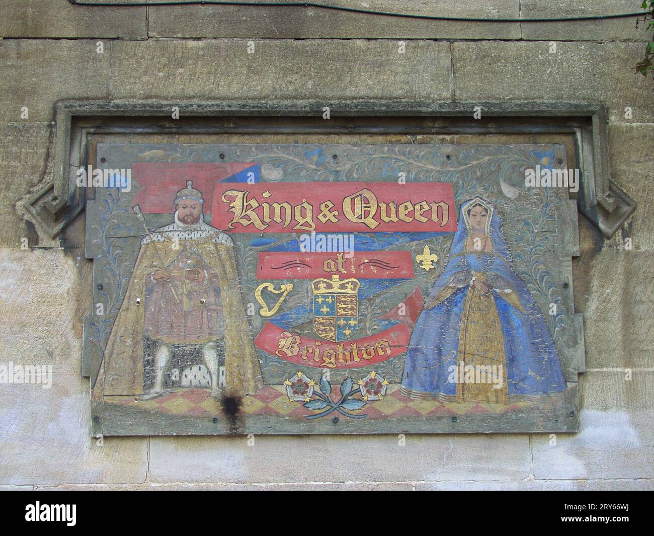 Old figures on the exterior wall of the King & Queen pub in Brighton ...