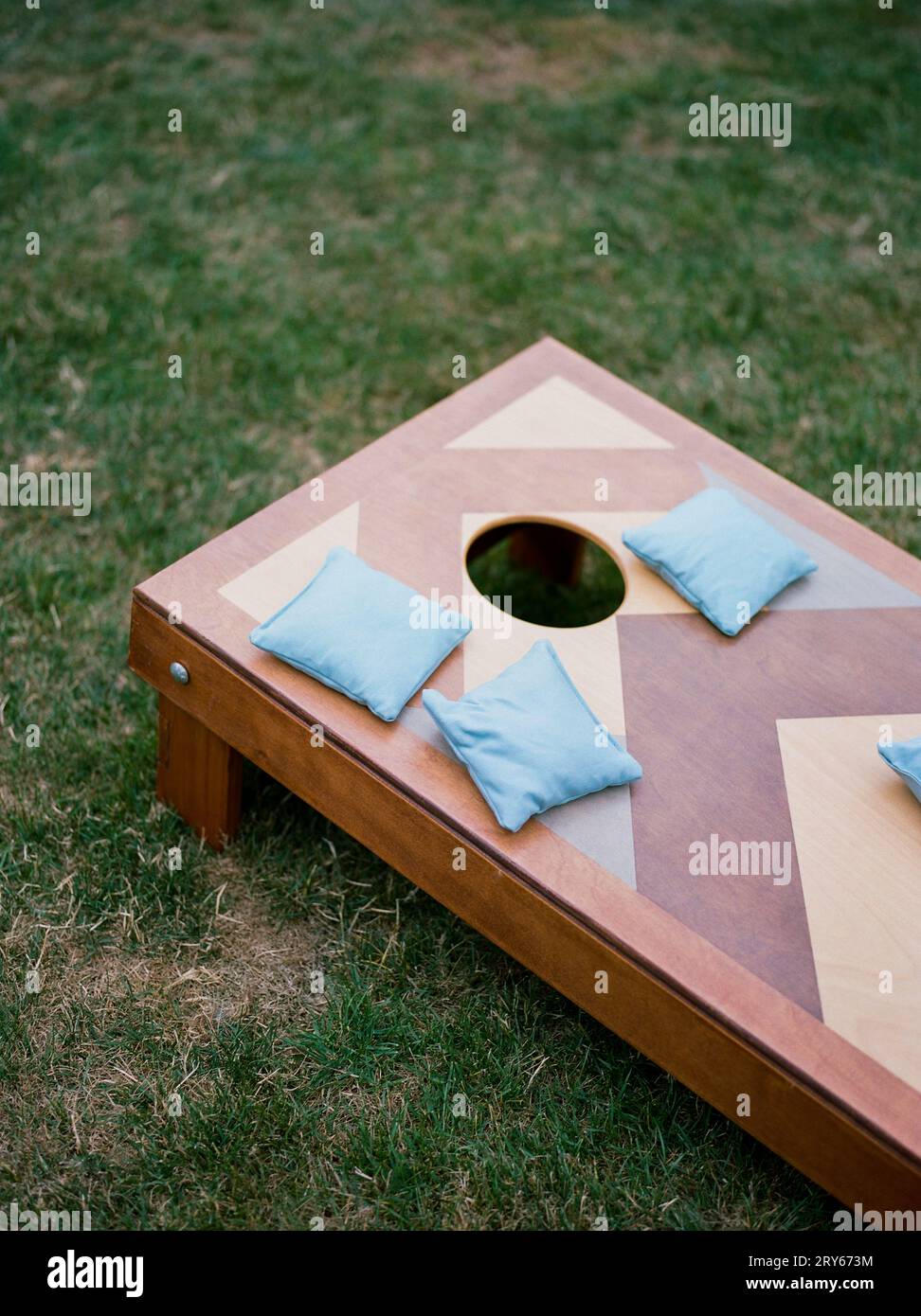 Wooden cornhole board in a backyard Stock Photo - Alamy