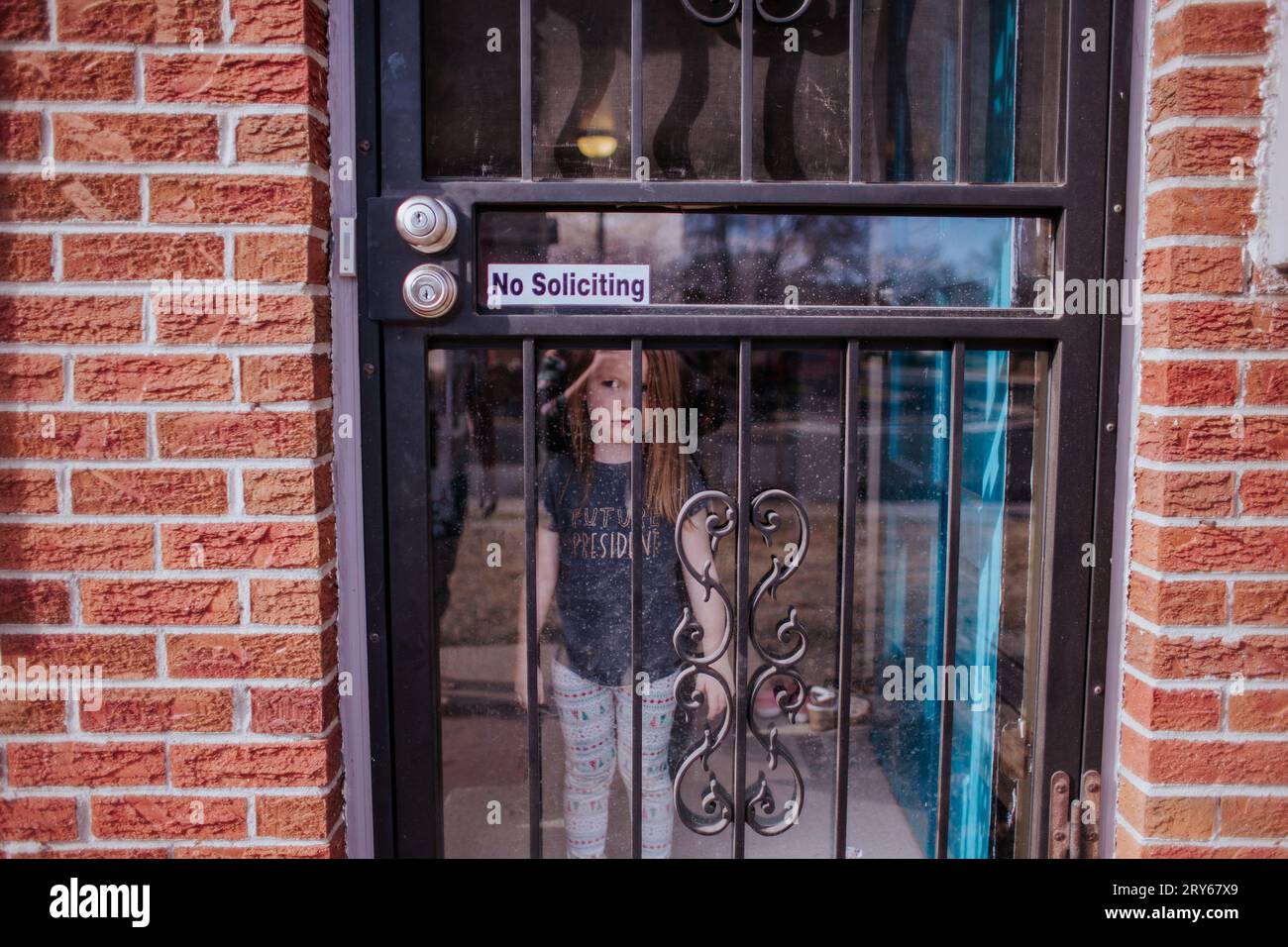 Upset toddler standing inside house Stock Photo - Alamy
