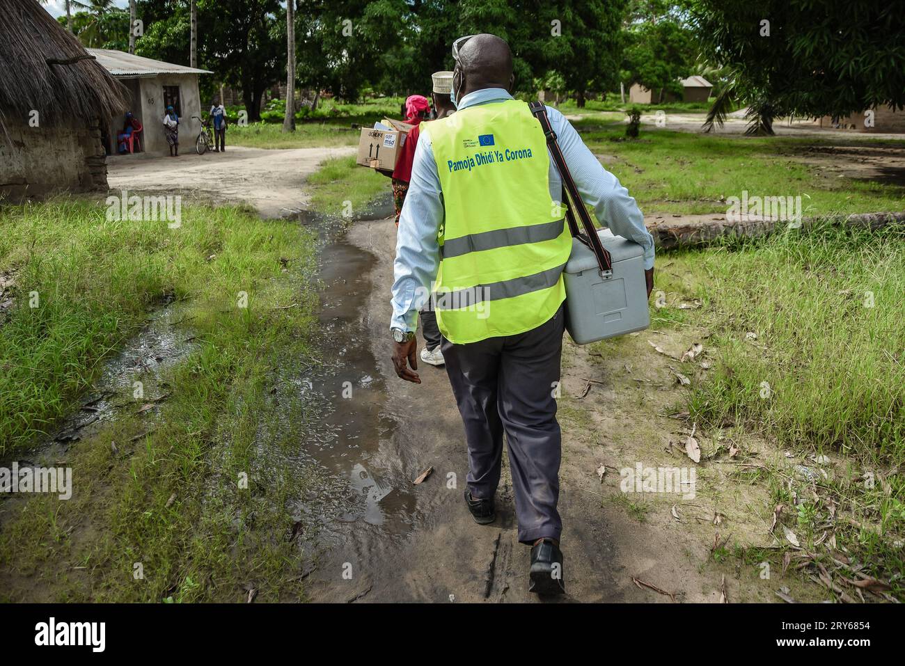 Community health workers (CHW) during a door to door Covid-19 ...