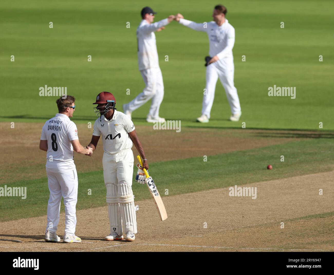 Surrey's Sai Sudharsan shakes hands with Hampshire's Liam Dawson after ...