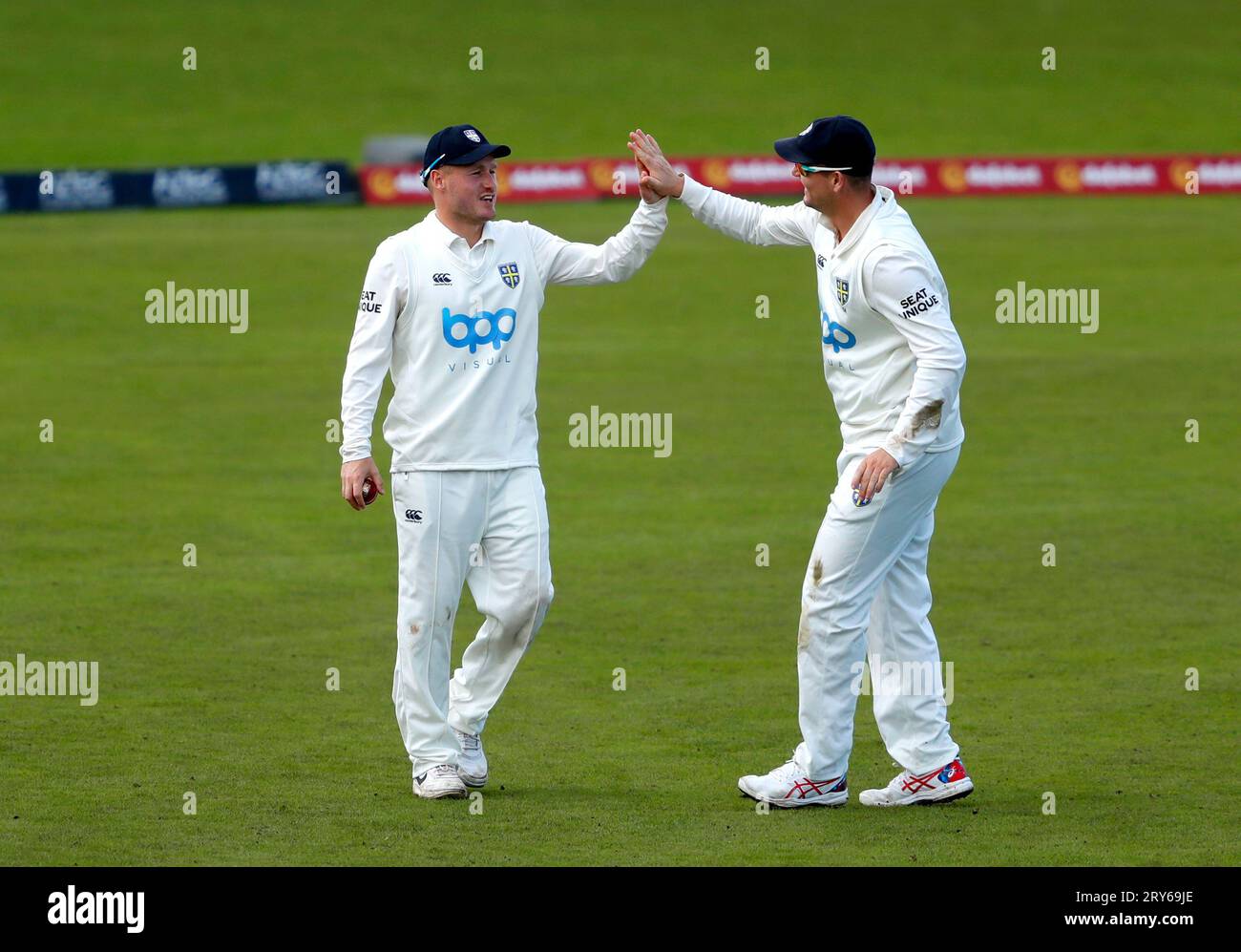 Durham's Matt Parkinson (left) celebrates after making the catch to ...