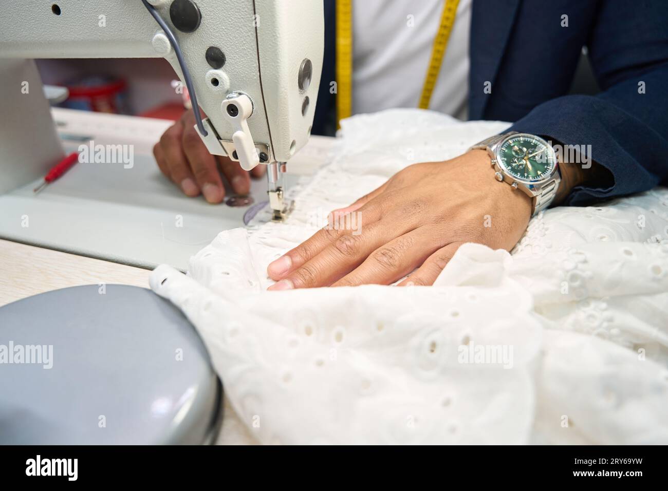 Sewer custom-making dress in his clothing studio Stock Photo - Alamy
