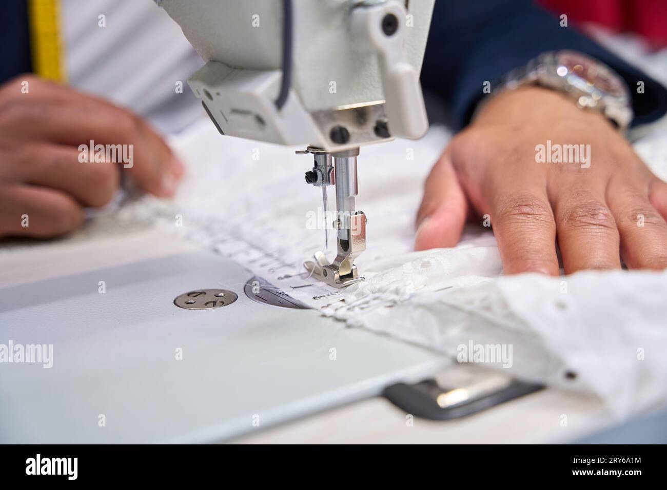 Master tailor sewing gown in tailoring workshop Stock Photo - Alamy