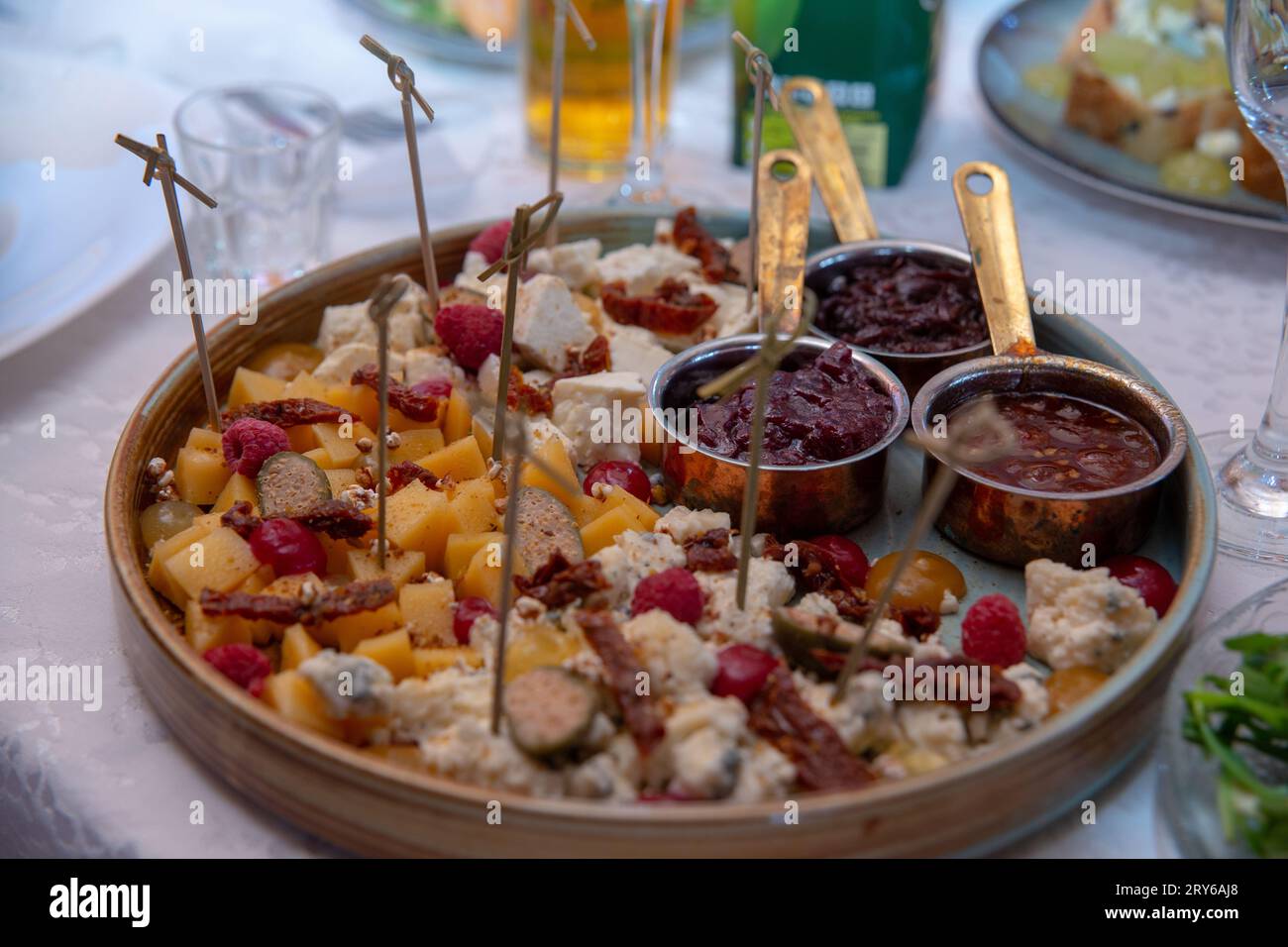 Catering plate. Assortment of snacks on the buffet table. Beautifully ...