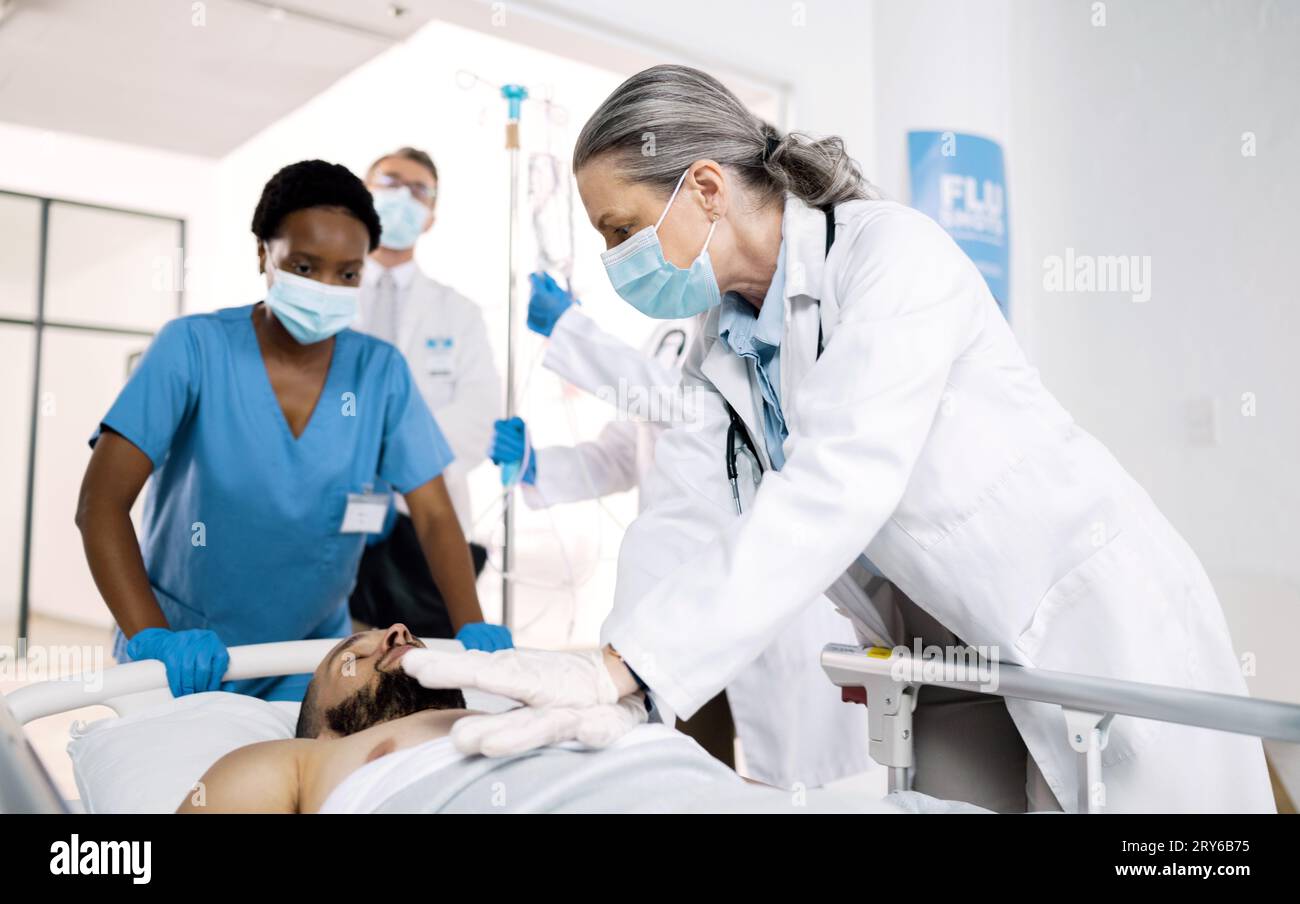 CPR, emergency and doctors with patient in hospital for medical service ...