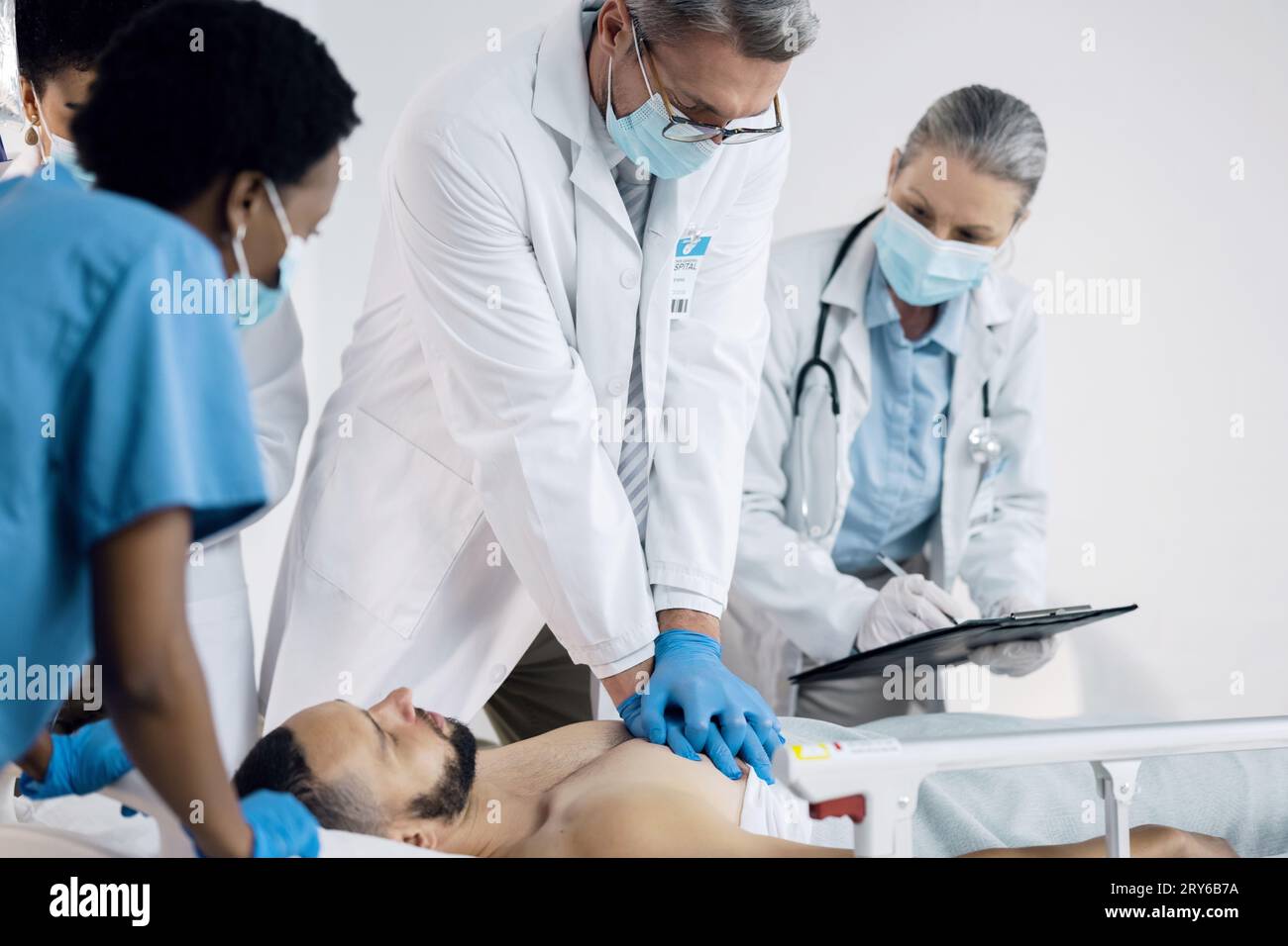 CPR, emergency and doctor with patient in hospital for medical service ...