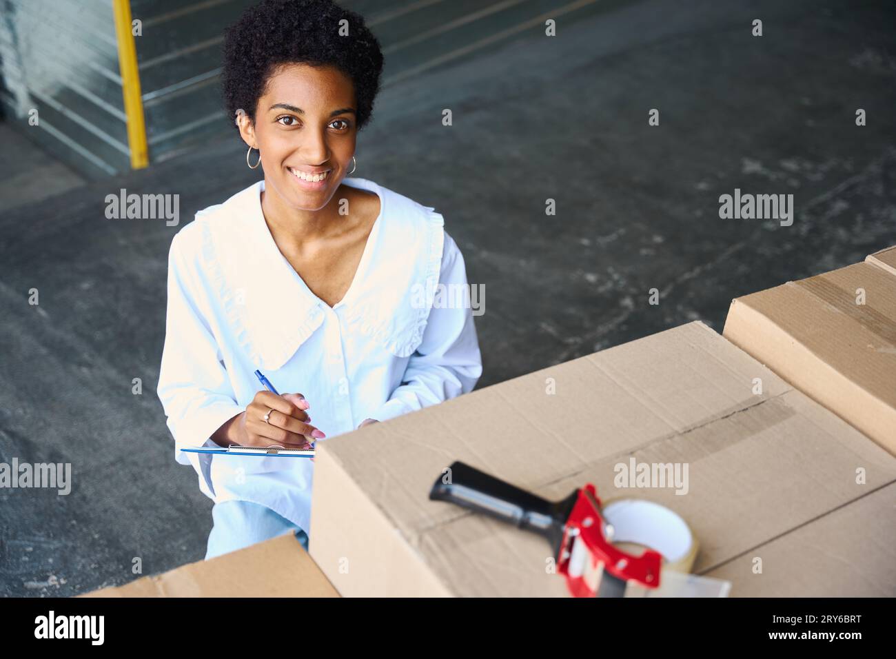 Beautiful woman makes an inventory of things being deposited Stock ...