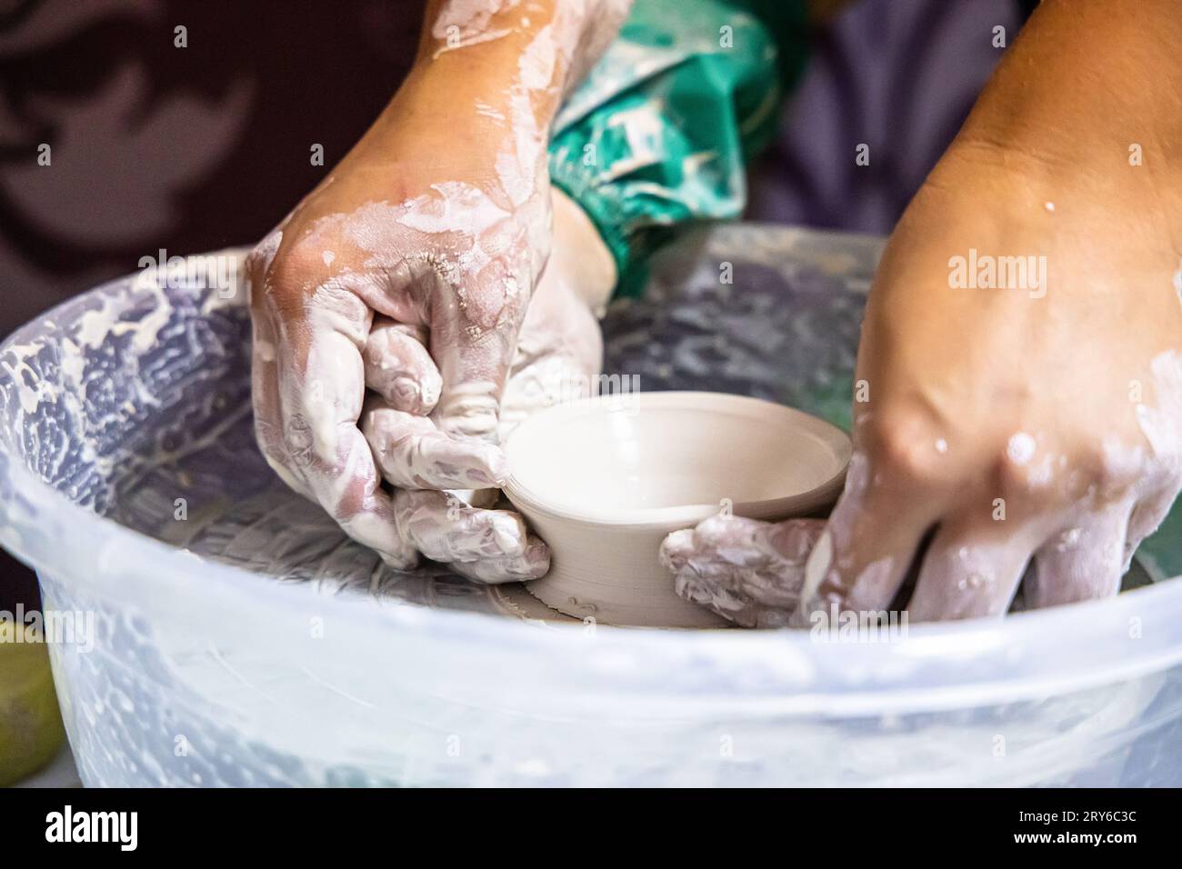 child's enthusiasm shines through as they experiment with clay on the ...