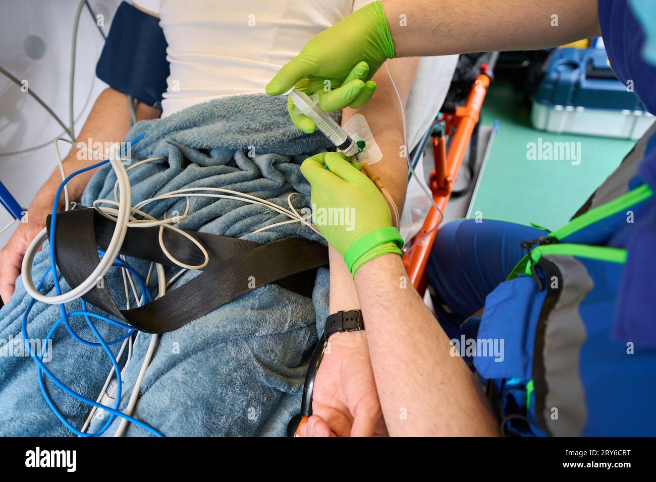 Visiting team doctor injects medicine to a patient Stock Photo - Alamy