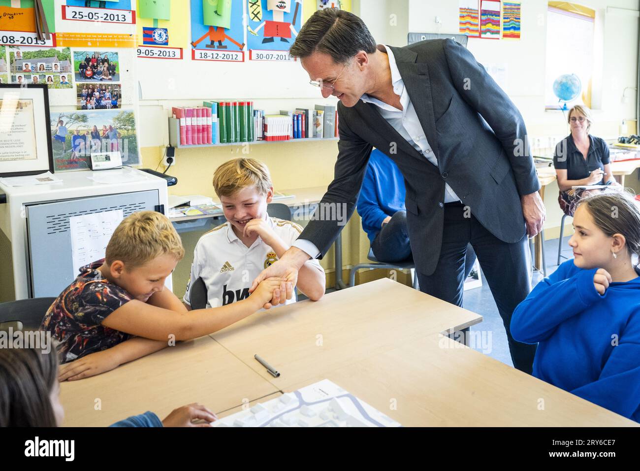 WOLTERSUM - Outgoing Prime Minister Mark Rutte talks to students from a ...