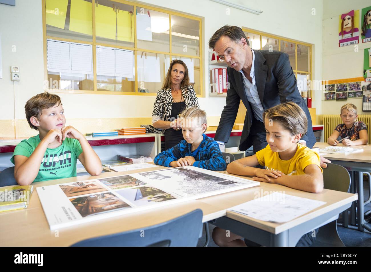 WOLTERSUM - Outgoing Prime Minister Mark Rutte talks to students from a ...
