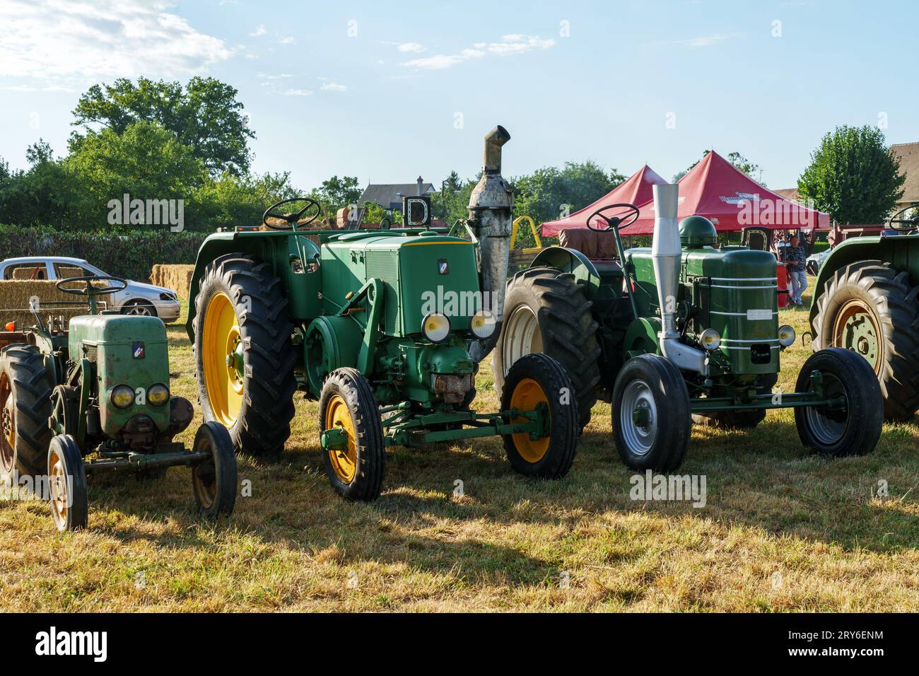 Vintage farming machinery on display at a harvest festival in France ...
