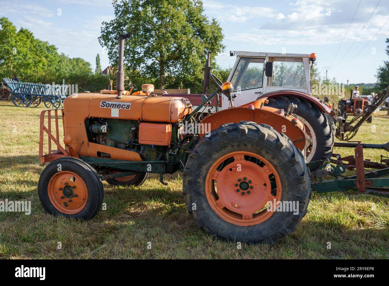 Vintage farming machinery on display at a harvest festival in France ...