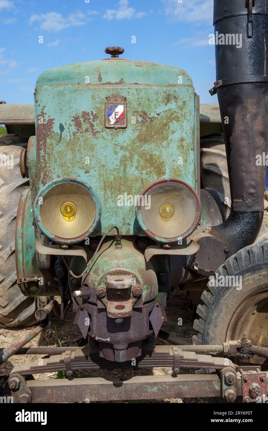 Vintage farming machinery on display at a harvest festival in France ...