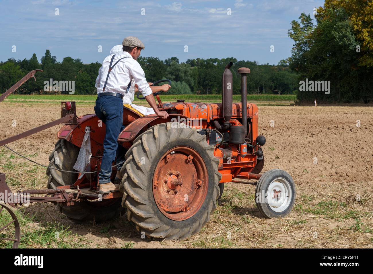 Competitors on vintage farm machinery taking place in a ploughing competition Stock Photo - Alamy