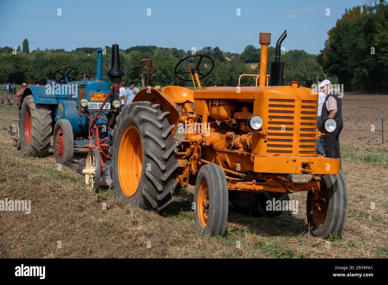 Vintage farming machinery on display at a harvest festival in France ...