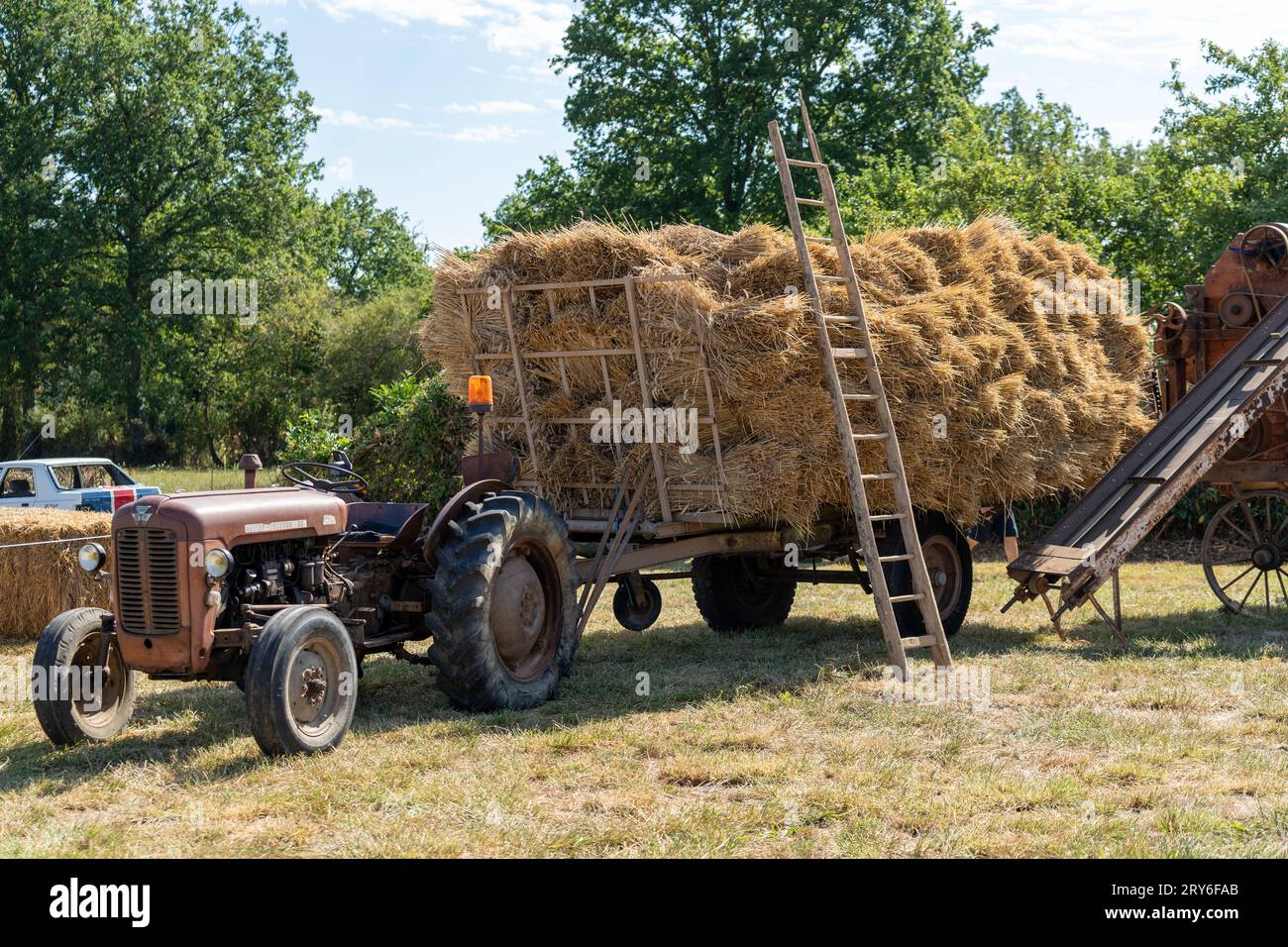 Vintage farming machinery on display at a harvest festival in France ...