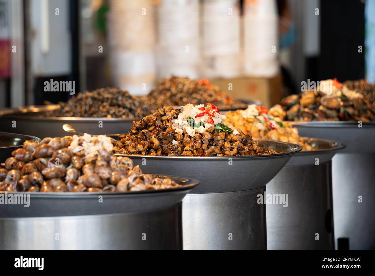 Stir-fried spicy flavored snail meat, delicious traditional street food ...