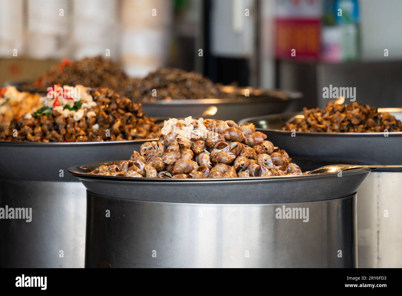 Stir-fried spicy flavored snail meat, delicious traditional street food ...