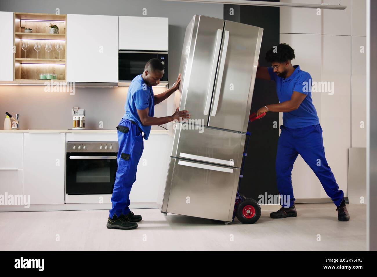 Man move fridge hi-res stock photography and images - Alamy