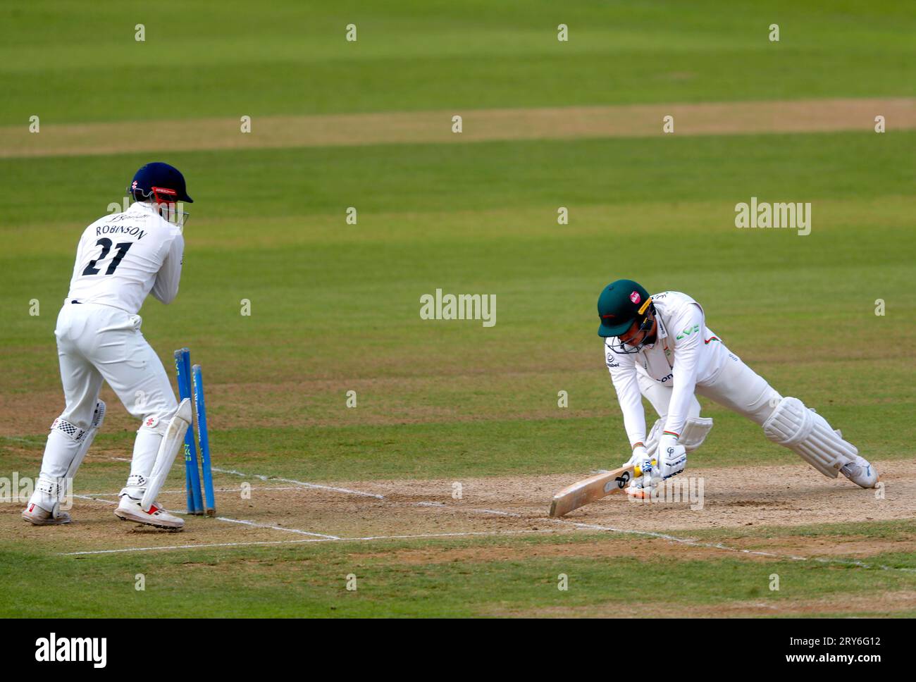 Leicestershire's Tom Scriven is stumped by Durham's Ollie Robinson ...