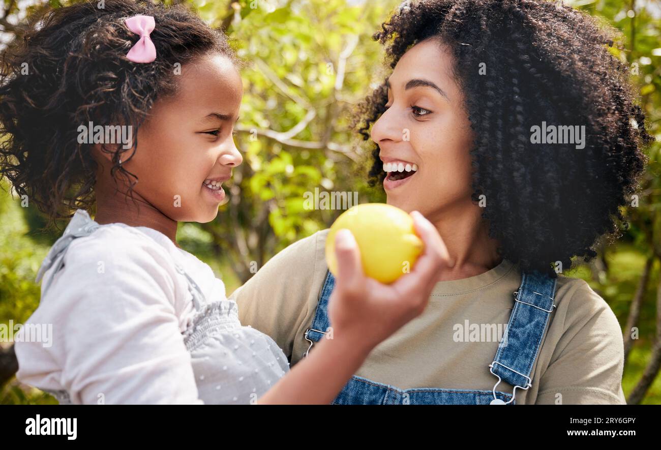 Happy, lemon and mother with girl, outdoor and happiness with hug ...