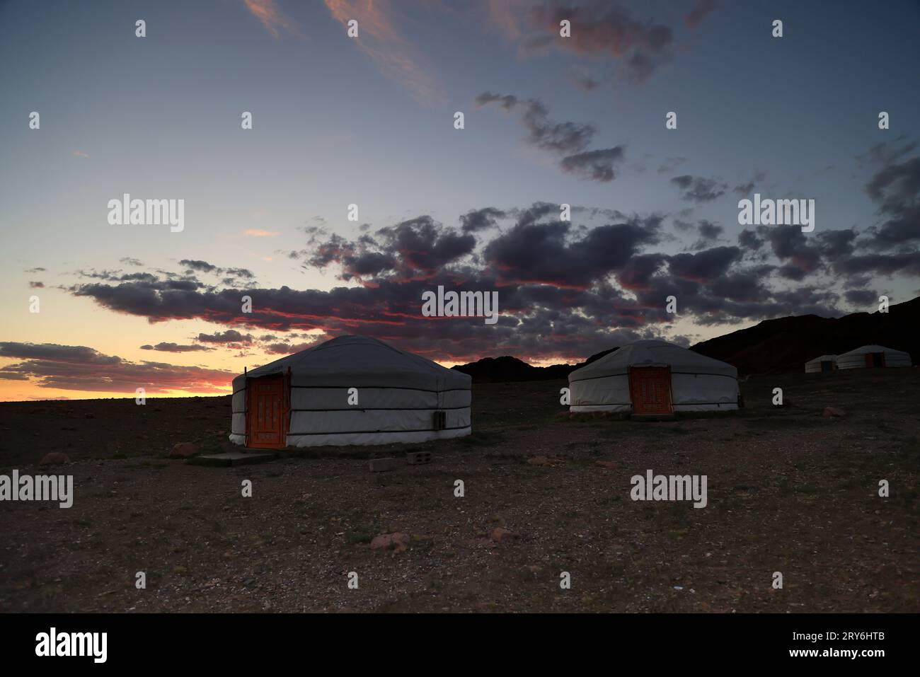 Traditional Mongolian Gers in a camp at sunset Stock Photo - Alamy