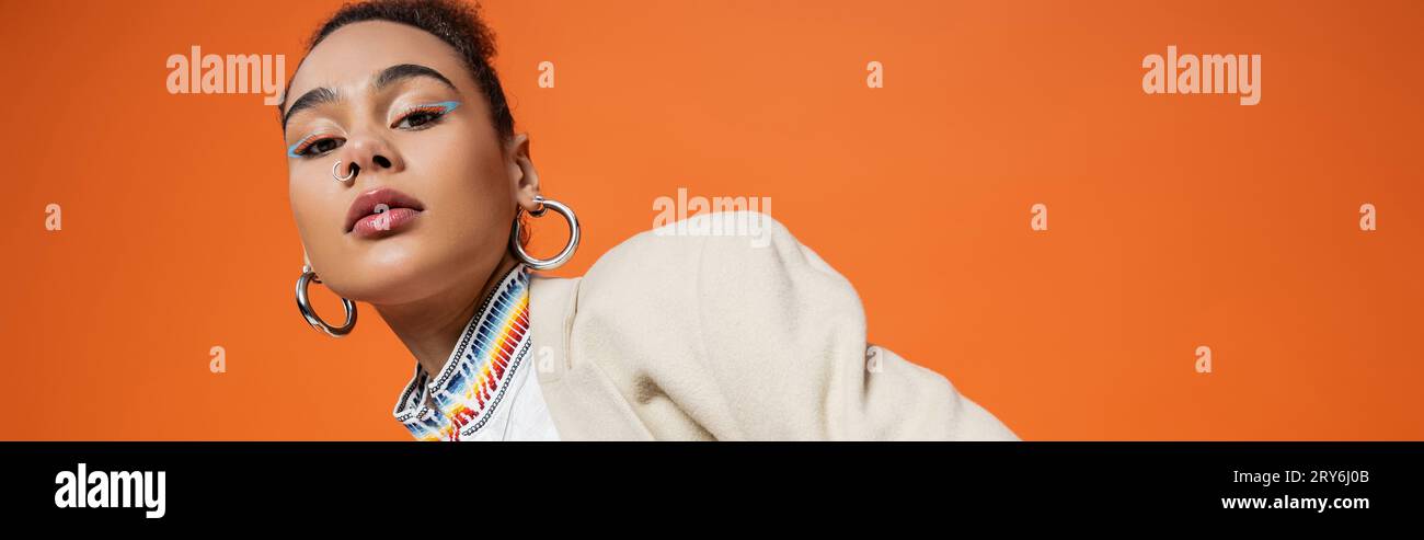 stylish african american model in urban outfit with accessories and ...