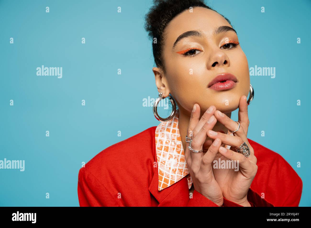 beautiful african american model in silver accessories and vibrant ...