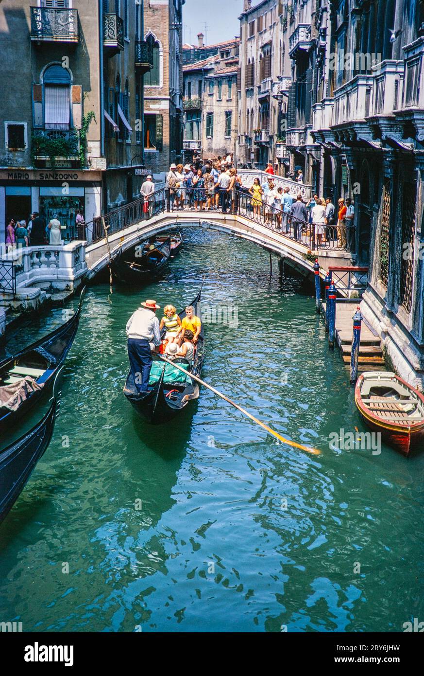 Gondolier gondola boat bridge crossing canal, Venice, Italy 1969 Stock ...