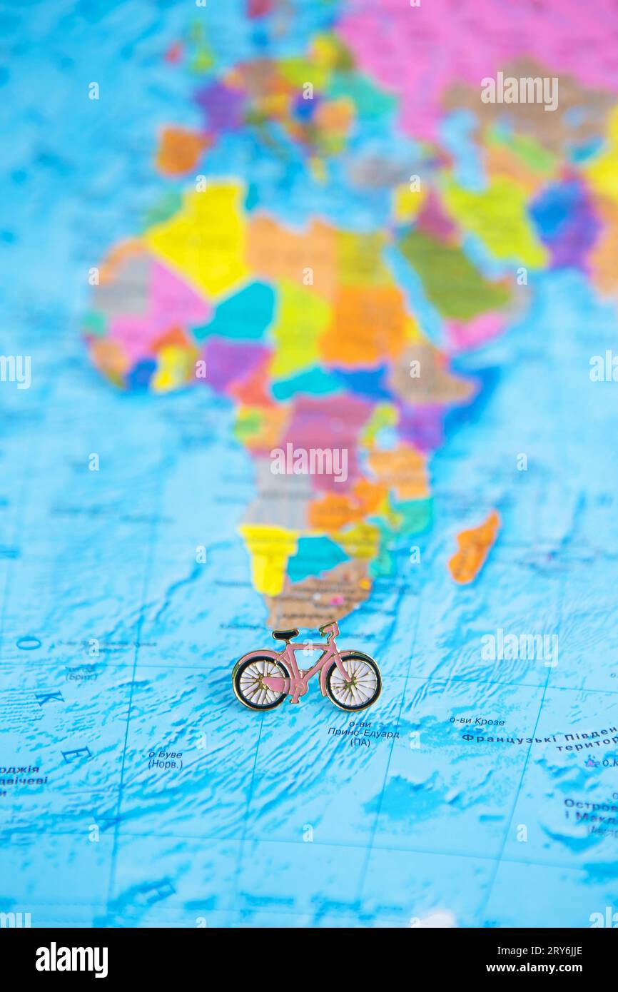 colorful mini bicycle on the world map Stock Photo - Alamy