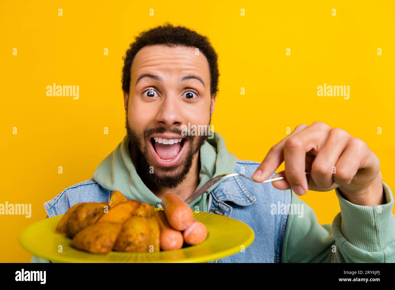 Portrait of impressed overjoyed person open mouth hold fork delicious ...