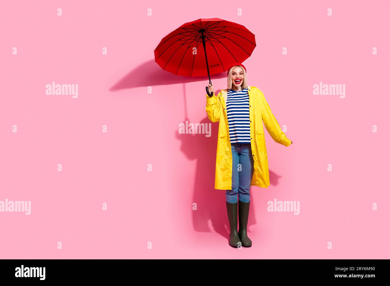 Full length photo of funky pretty woman dressed rain coat walking under ...