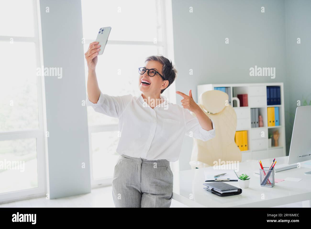 Photo of positive cool lady coach wear white shirt recording video vlog ...