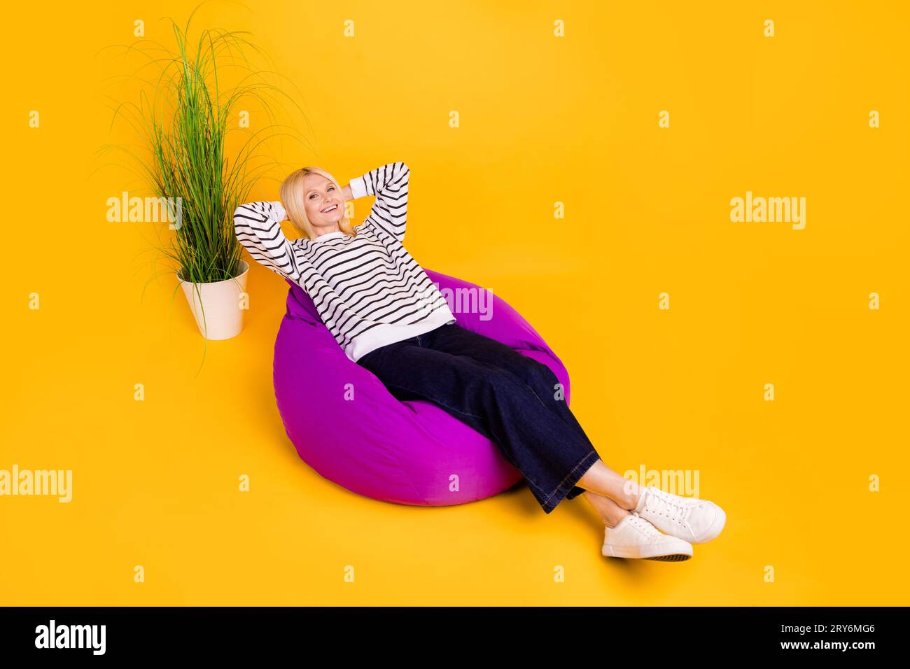 Photo of positive mature lady sitting comfy chair enjoy relax isolated ...