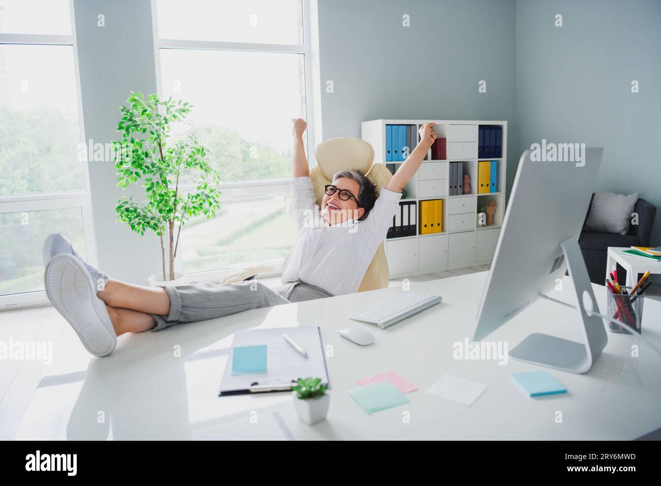 Full body length photo of lying legs over desktop workplace woman ...