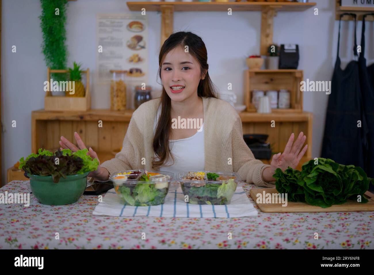 Pretty woman is livestreaming for sell healthy food. Vlogging and ...