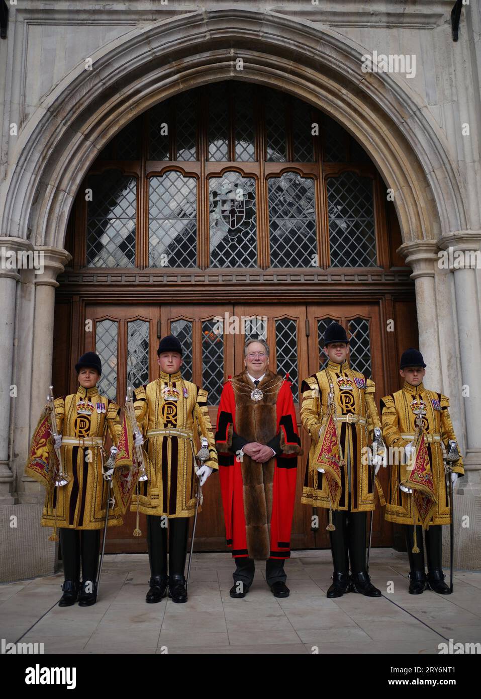 Alderman Professor Michael Mainelli (centre) poses with trumpeters ...