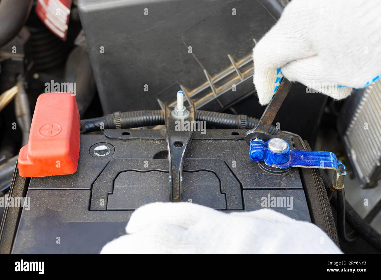 the driver is replacing the car battery. battery terminal installation ...